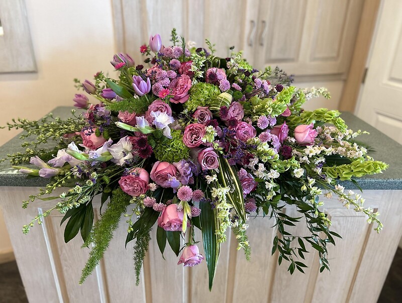 Pretty and Purple Casket Piece arranged by a florist in Idaho Falls, ID ...